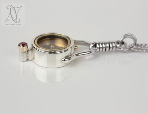 Elegant Silver Compass Pendant with Ruby | Rock Water Studio